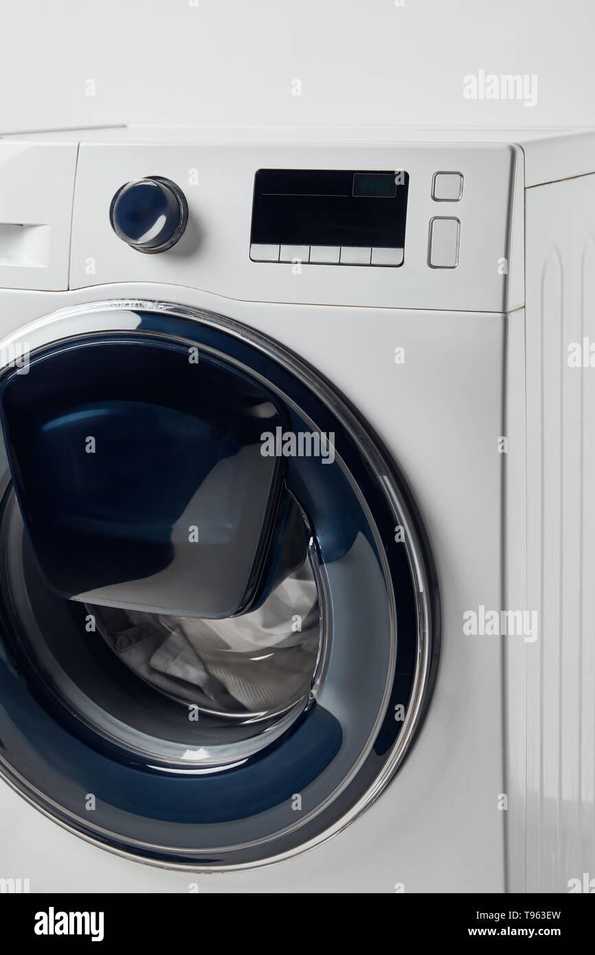 Modern washing machine with black display isolated on grey Stock Photo ...