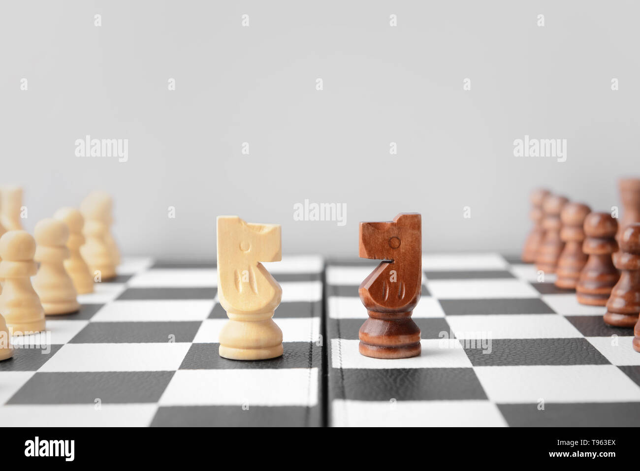 Chess pieces on game board Stock Photo - Alamy