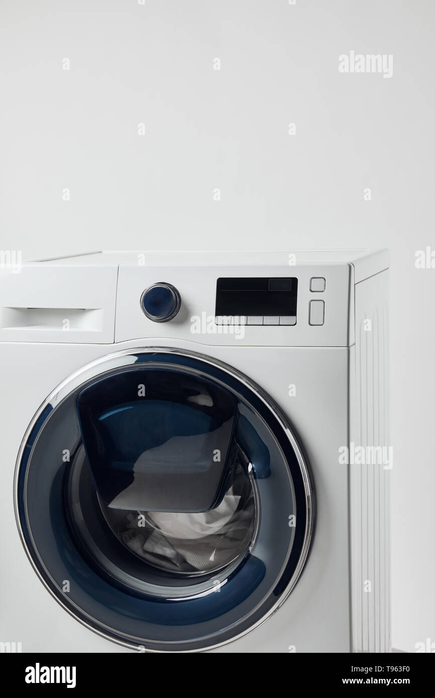 Modern washing machine with black display isolated on grey Stock Photo ...