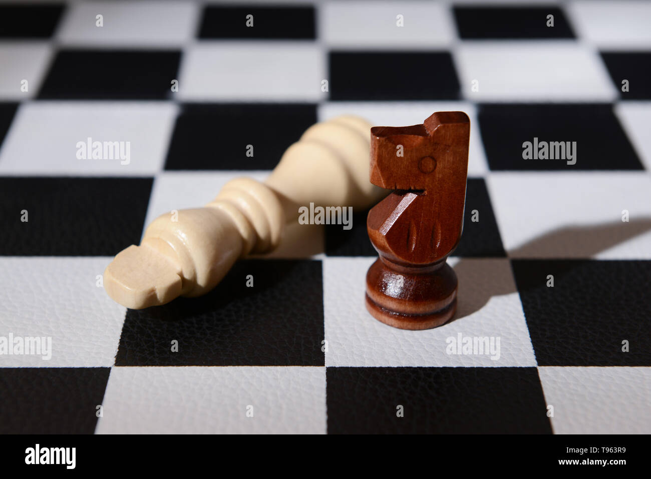 Chess pieces on game board Stock Photo - Alamy