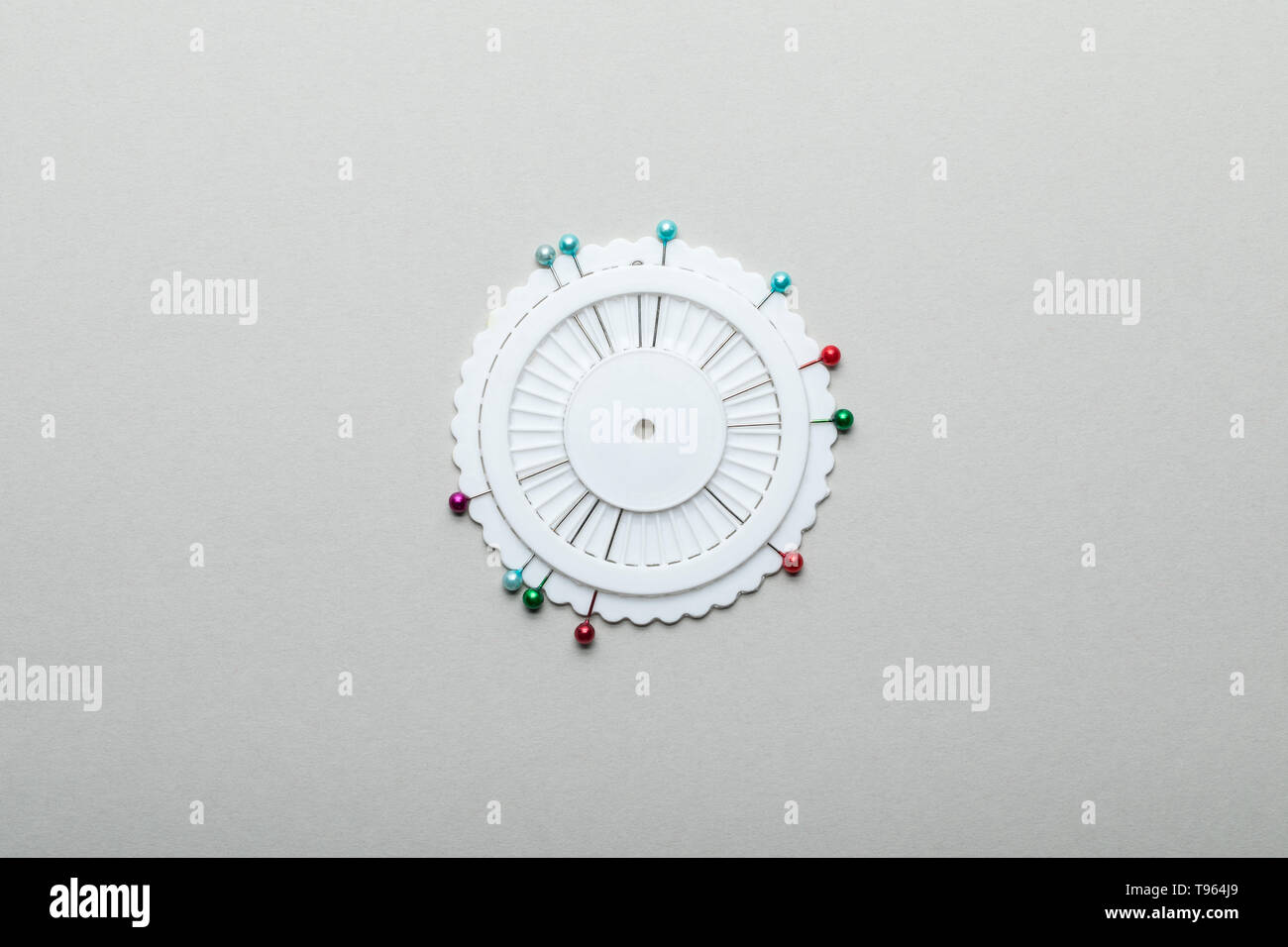 top view of sewing pins in round container isolated on grey Stock Photo ...