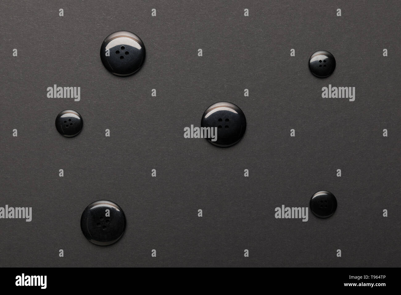 top view of clothing buttons isolated on black Stock Photo - Alamy