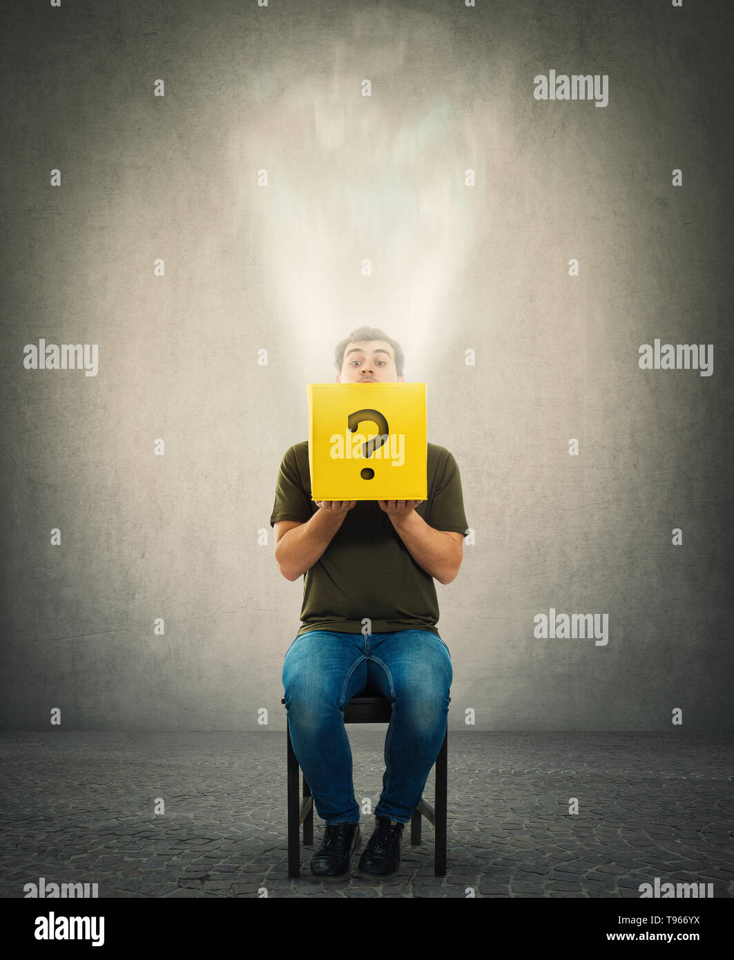 Curious man sitting on a chair looking cautious inside a mysterious ...
