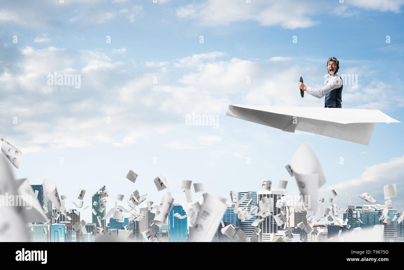 Screaming pilot sitting in paper plane Stock Photo - Alamy
