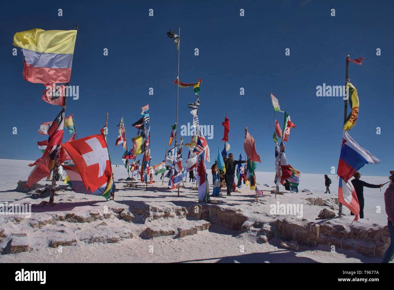 Flags on the vast salt flats of Salar de Uyuni, Bolivia Stock Photo - Alamy