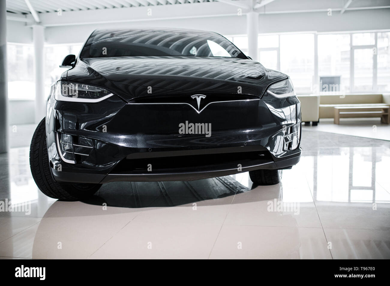 Tesla New-generation Electric Car of Dark Brown Indoor Stock Photo - Alamy