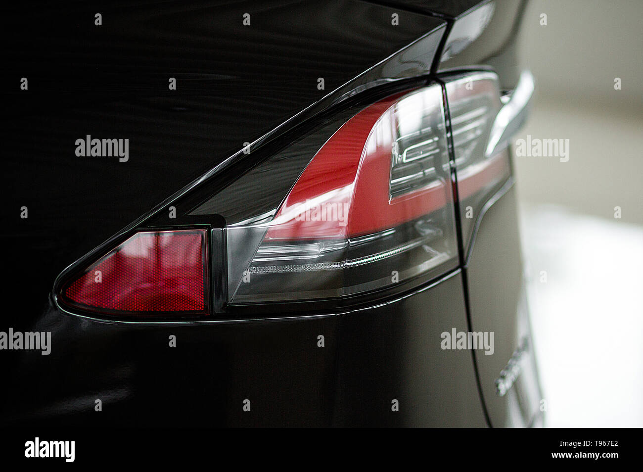 Tesla New-generation Electric Car of Dark Brown Indoor Stock Photo - Alamy