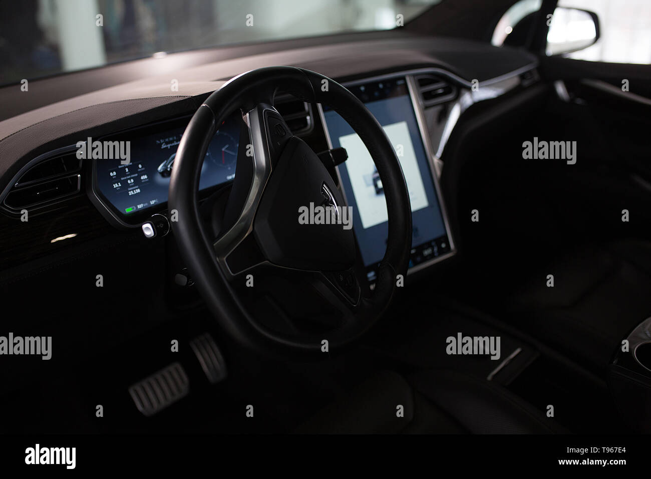 Tesla New-generation Electric Car of Dark Brown Indoor Stock Photo - Alamy