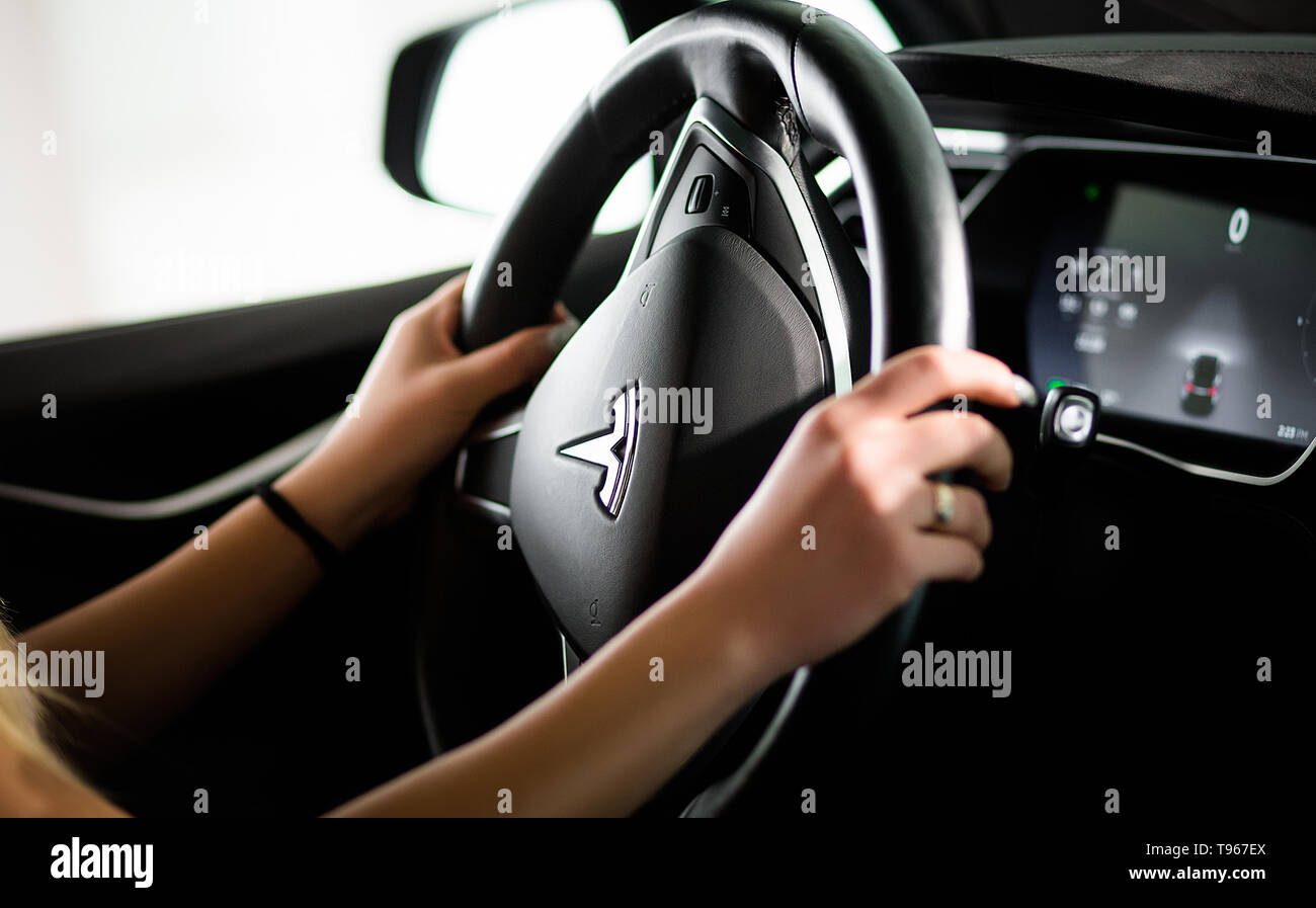 Tesla New-generation Electric Car of Dark Brown Indoor Stock Photo - Alamy