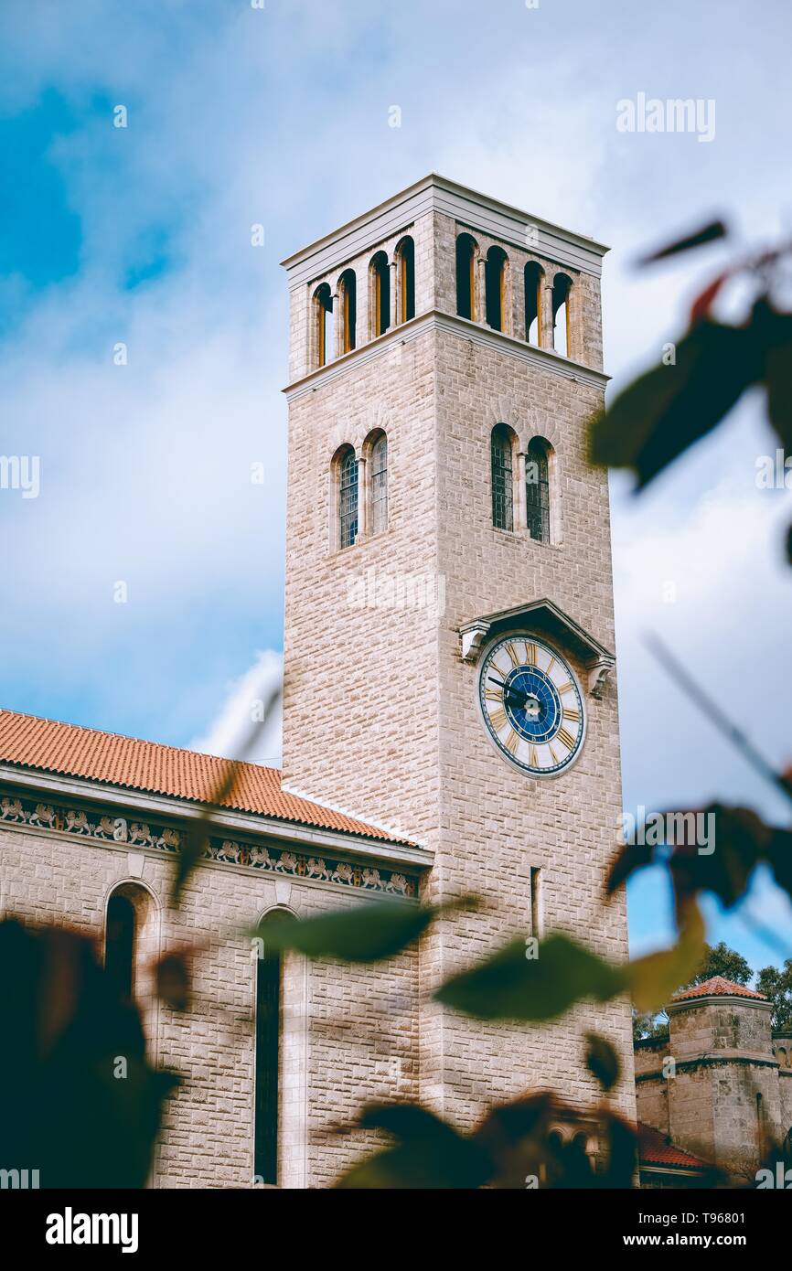 A tall stone clocktower Stock Photo - Alamy