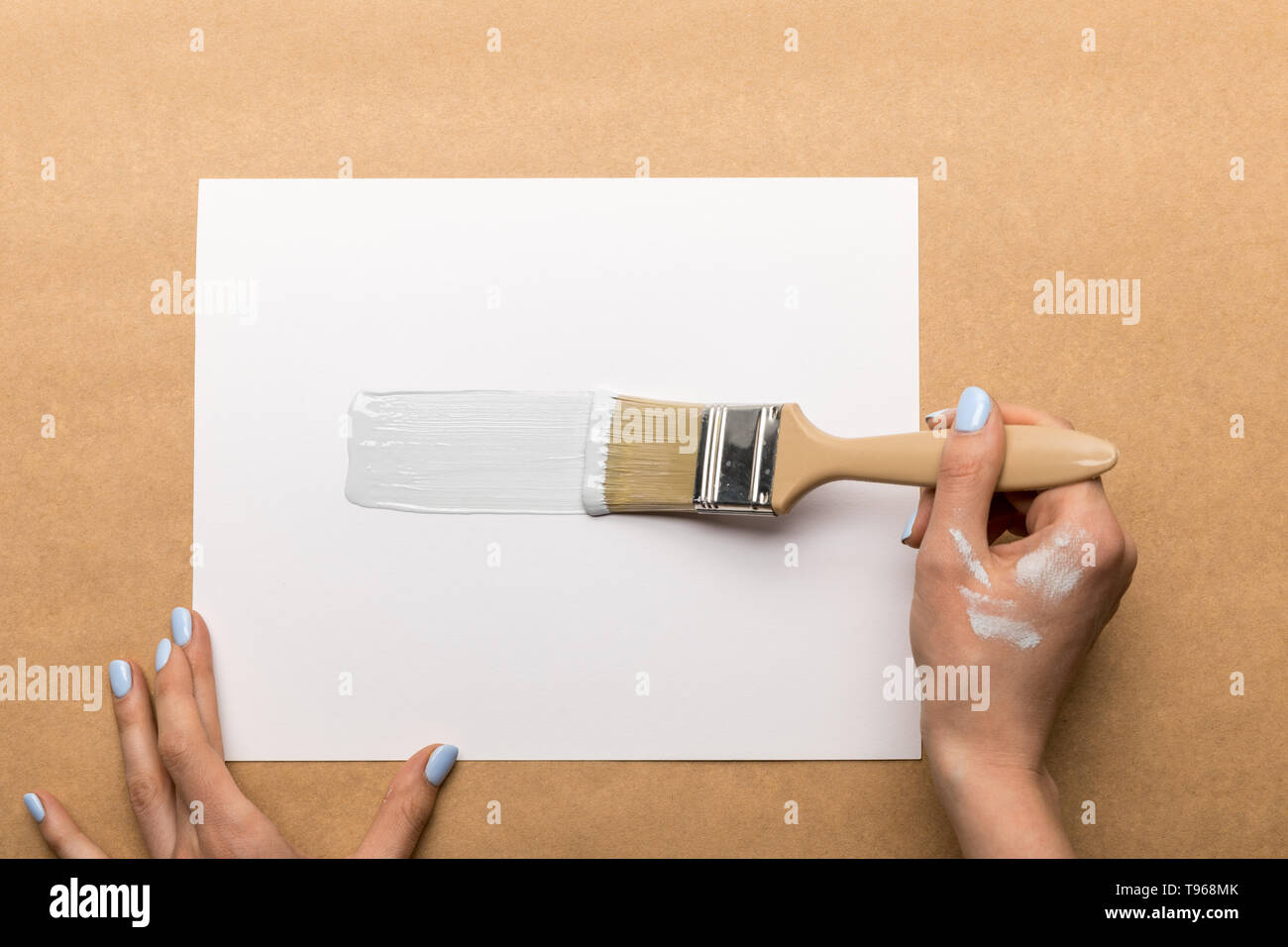 partial view of woman painting with brush on paper Stock Photo - Alamy