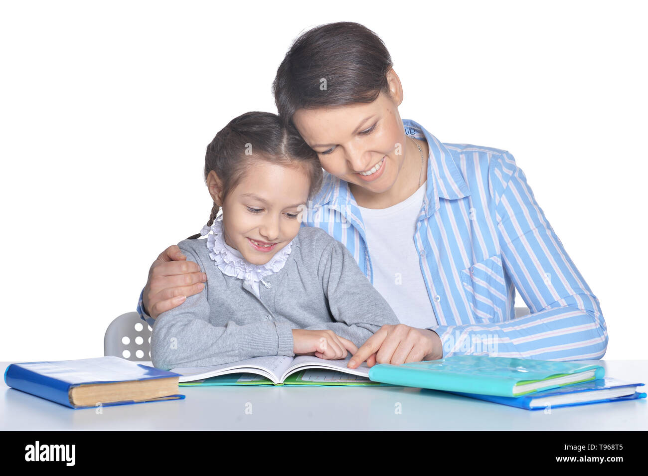 Mother with daughter reading books isolated on white background Stock ...