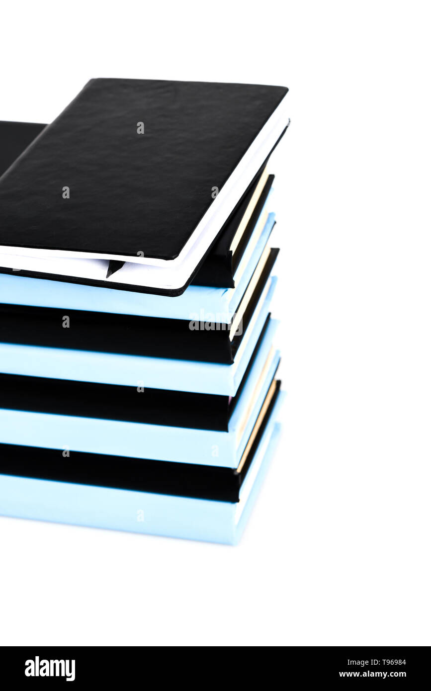 Stack of black and blue books isolated on white Stock Photo - Alamy