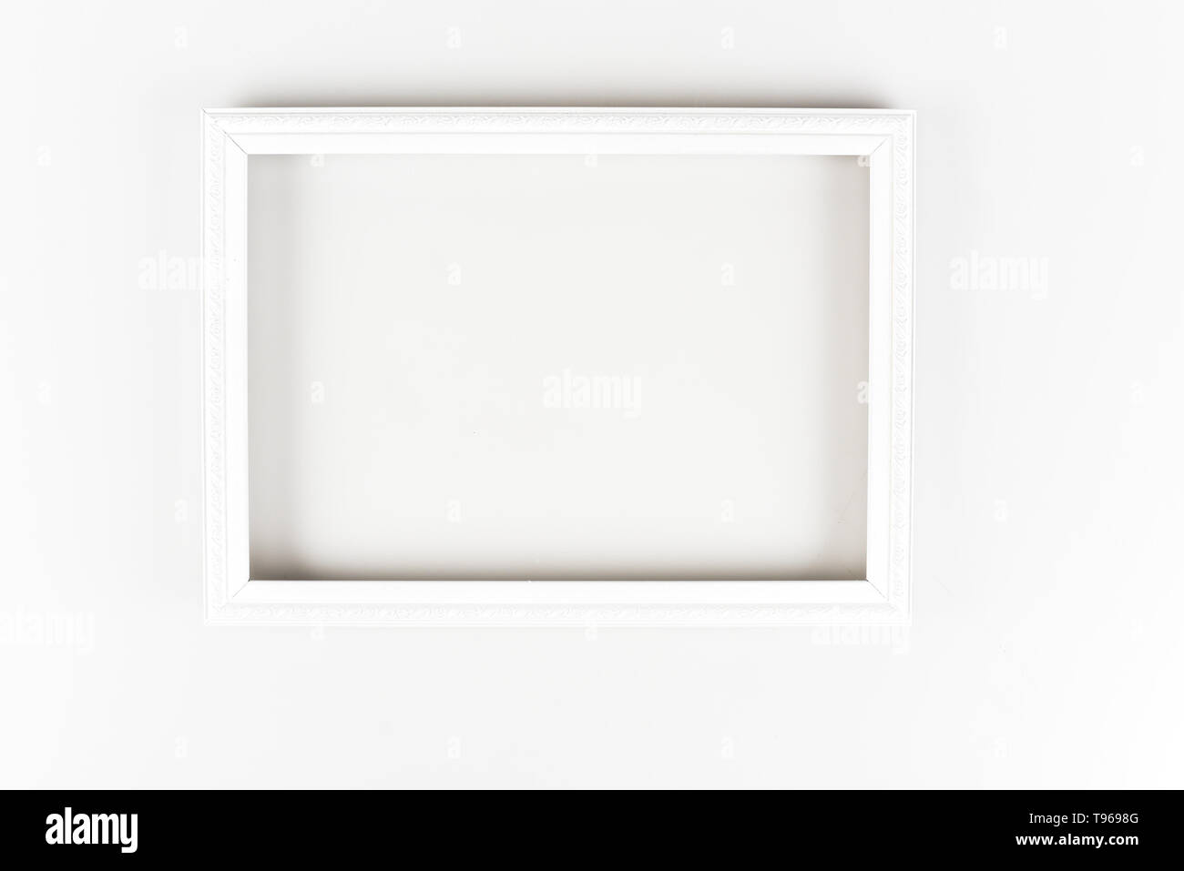 White decorative frame with ornament on white surface Stock Photo - Alamy