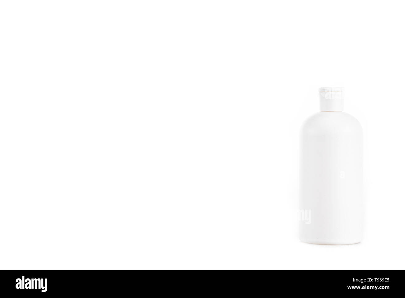 White cosmetic bottle with cap isolated on white Stock Photo - Alamy