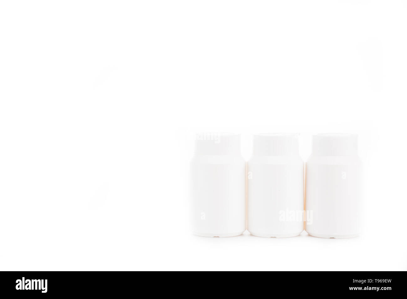 White cosmetic containers with caps isolated on white Stock Photo - Alamy