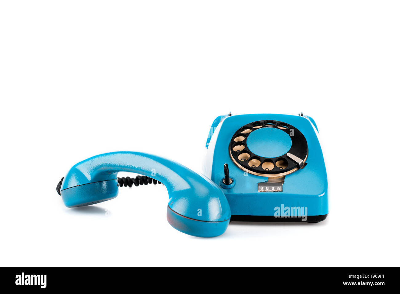 Blue vintage telephone with handset and wire on white Stock Photo - Alamy