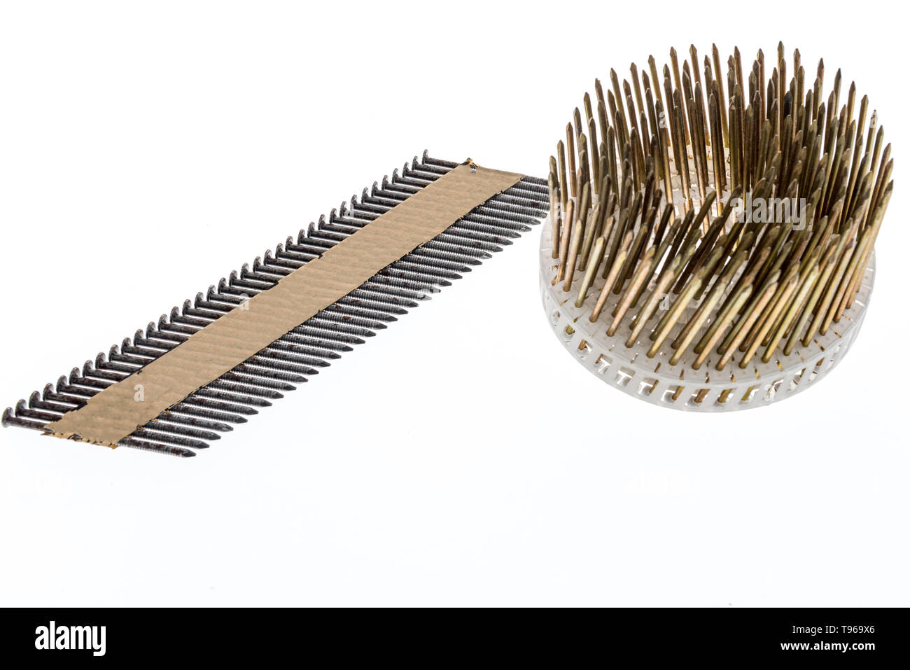 A stick and coil of nails used in pnuematic tools for building Stock ...