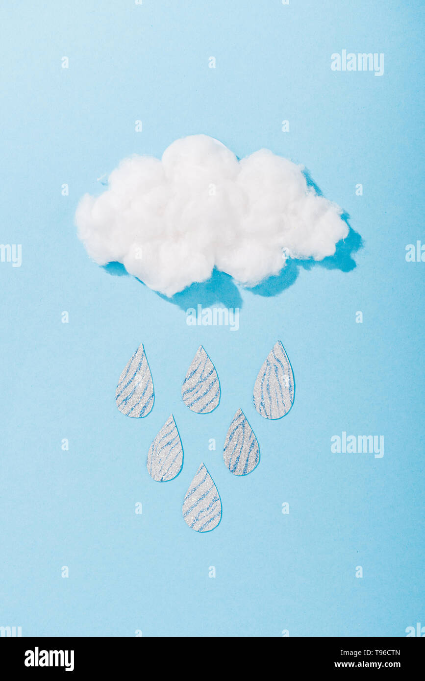 top view of cotton candy cloud with glitter raindrops on blue Stock ...