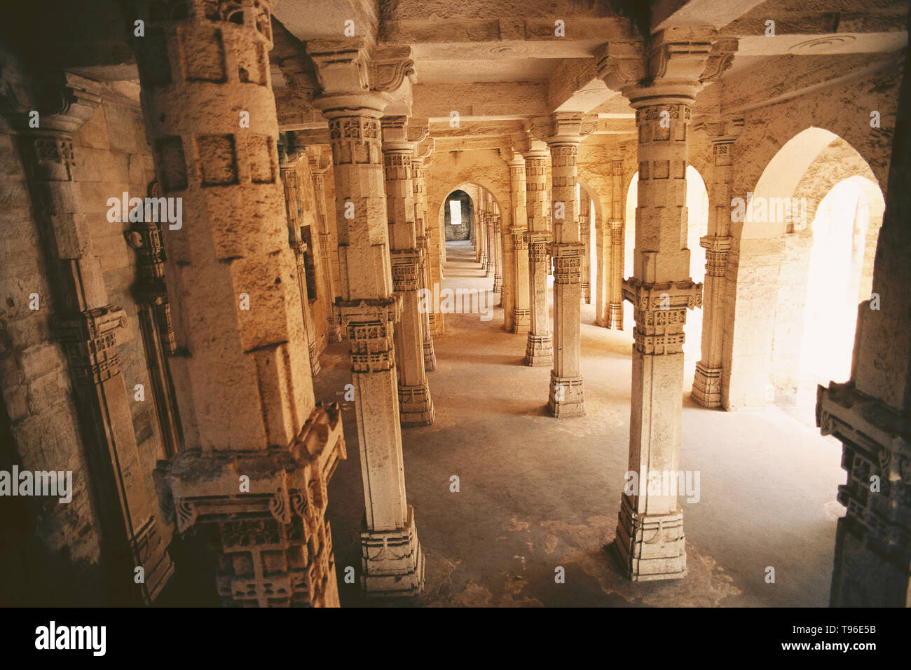 VIEW OF SCULPTURAL COLOUMNS OF A JAIN TEMPLE ON TOP OF GIR MOUNTAIN ...