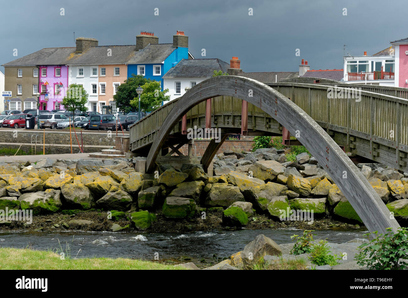 Across a footbridge towards colourful houses in Aberaeron, Wales Stock ...