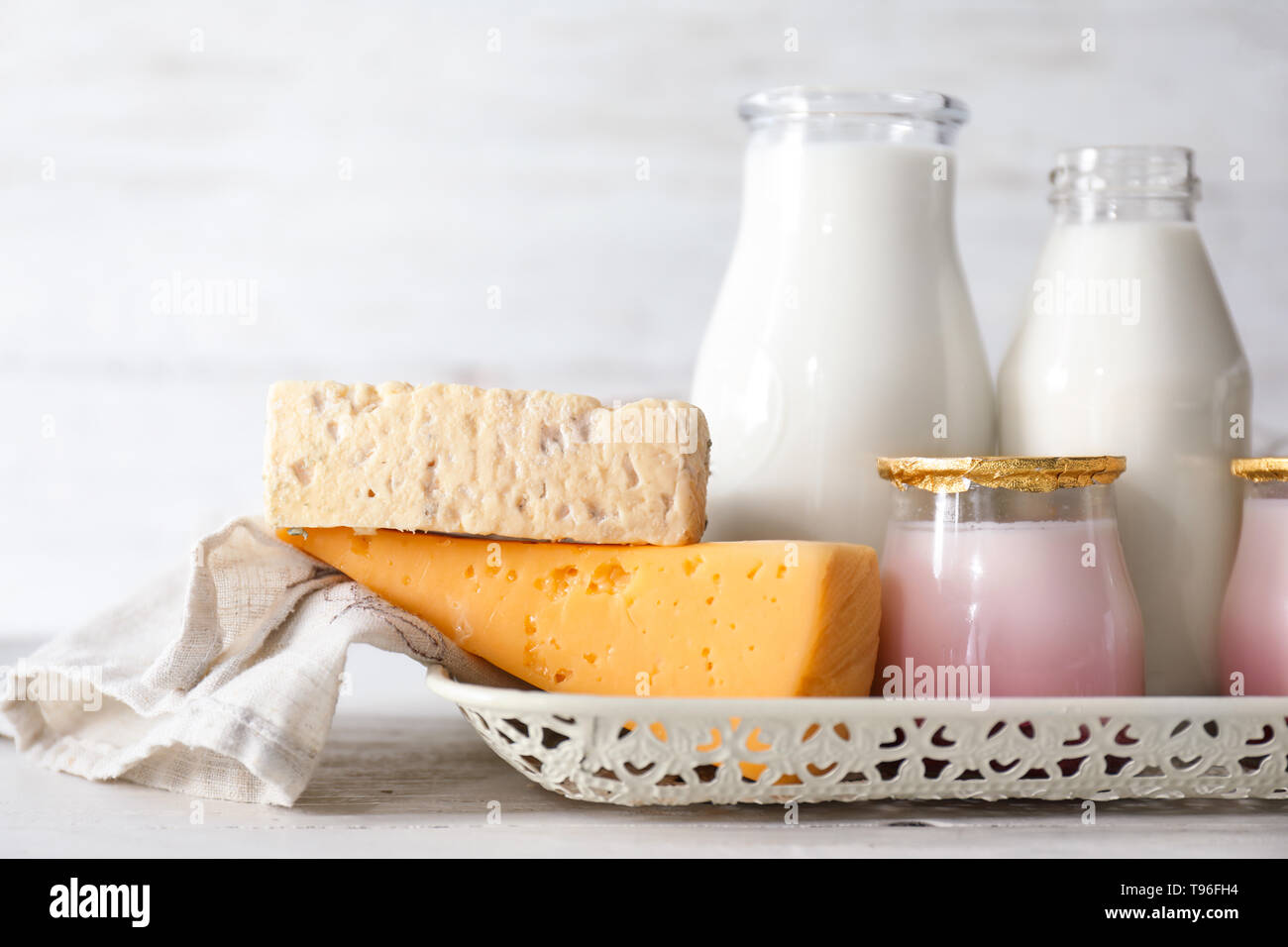 Different milk products on light table Stock Photo - Alamy