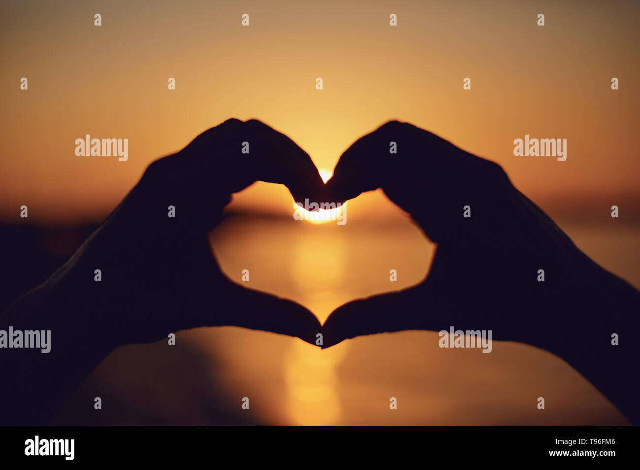 Heart in sunset hi-res stock photography and images - Alamy