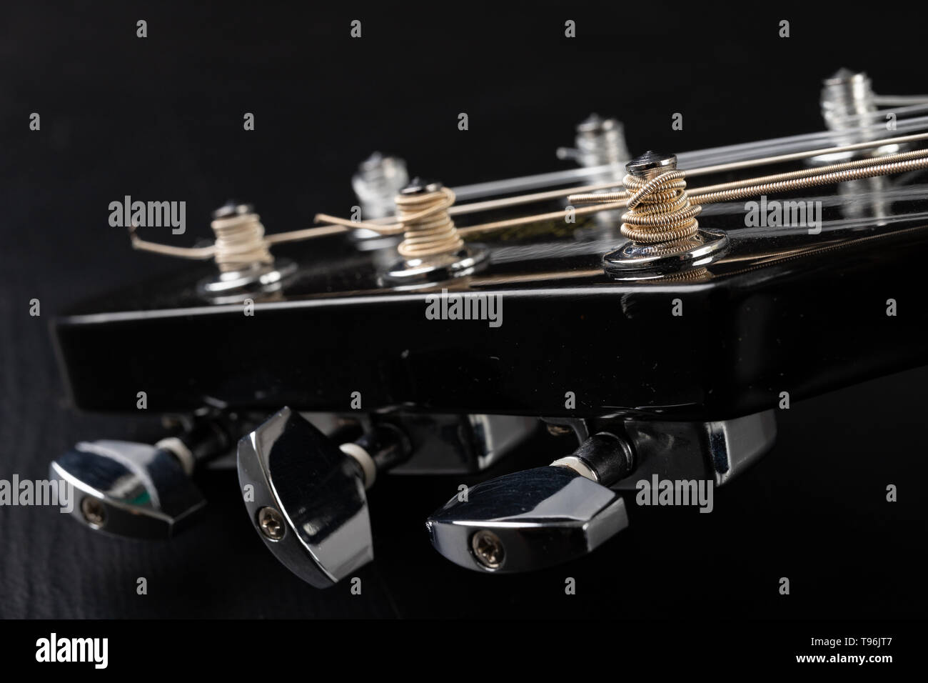 Classical guitar on a dark wooden table. Musical instrument stringed ...
