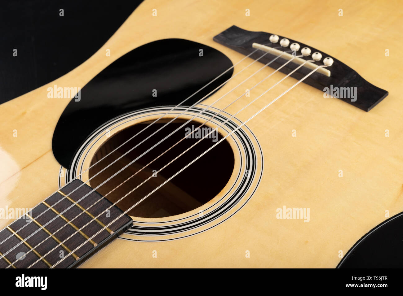 Classical guitar on a dark wooden table. Musical instrument stringed ...