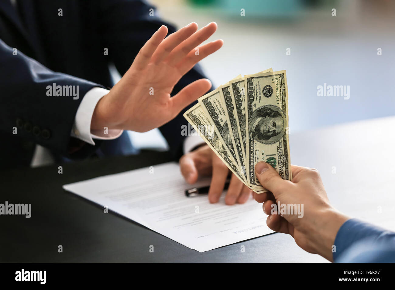 Businessman refusing to take bribe. Corruption concept Stock Photo - Alamy