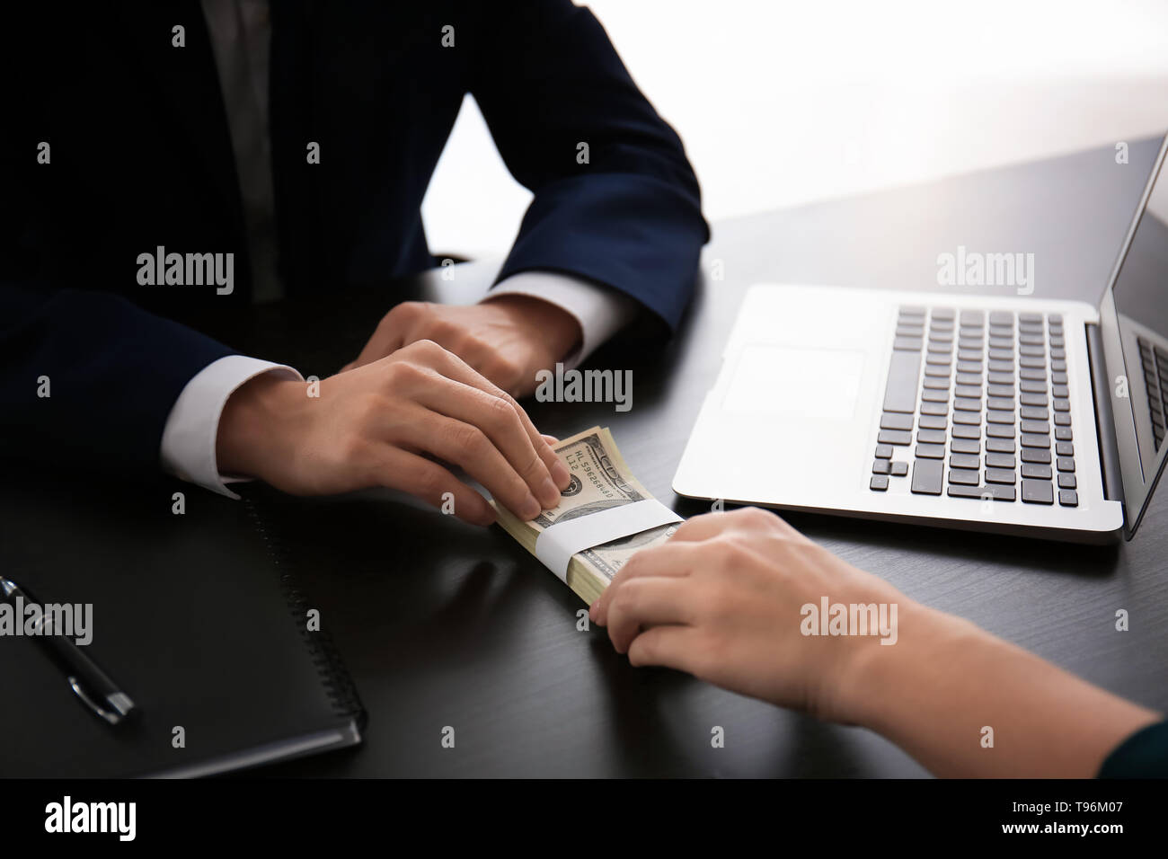 Woman giving bribe to businessman. Corruption concept Stock Photo - Alamy