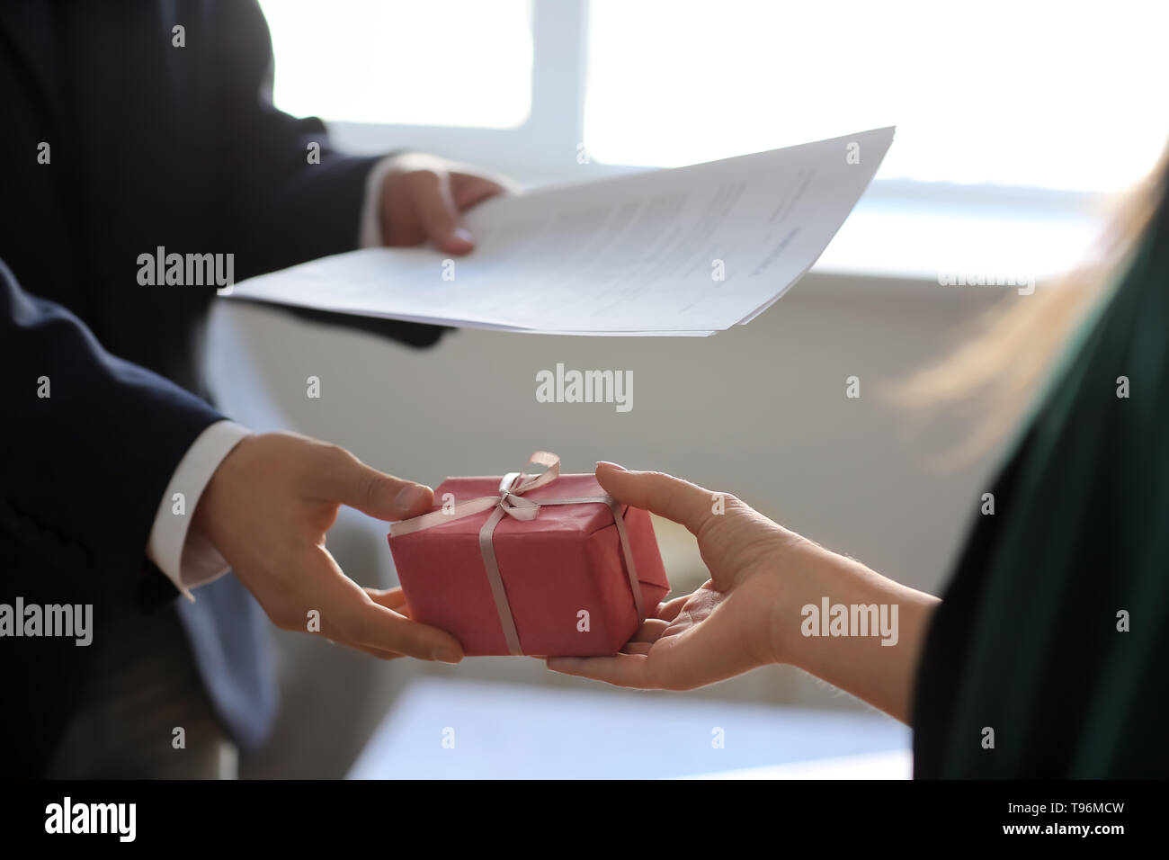 Businessman taking bribe from woman. Corruption concept Stock Photo - Alamy