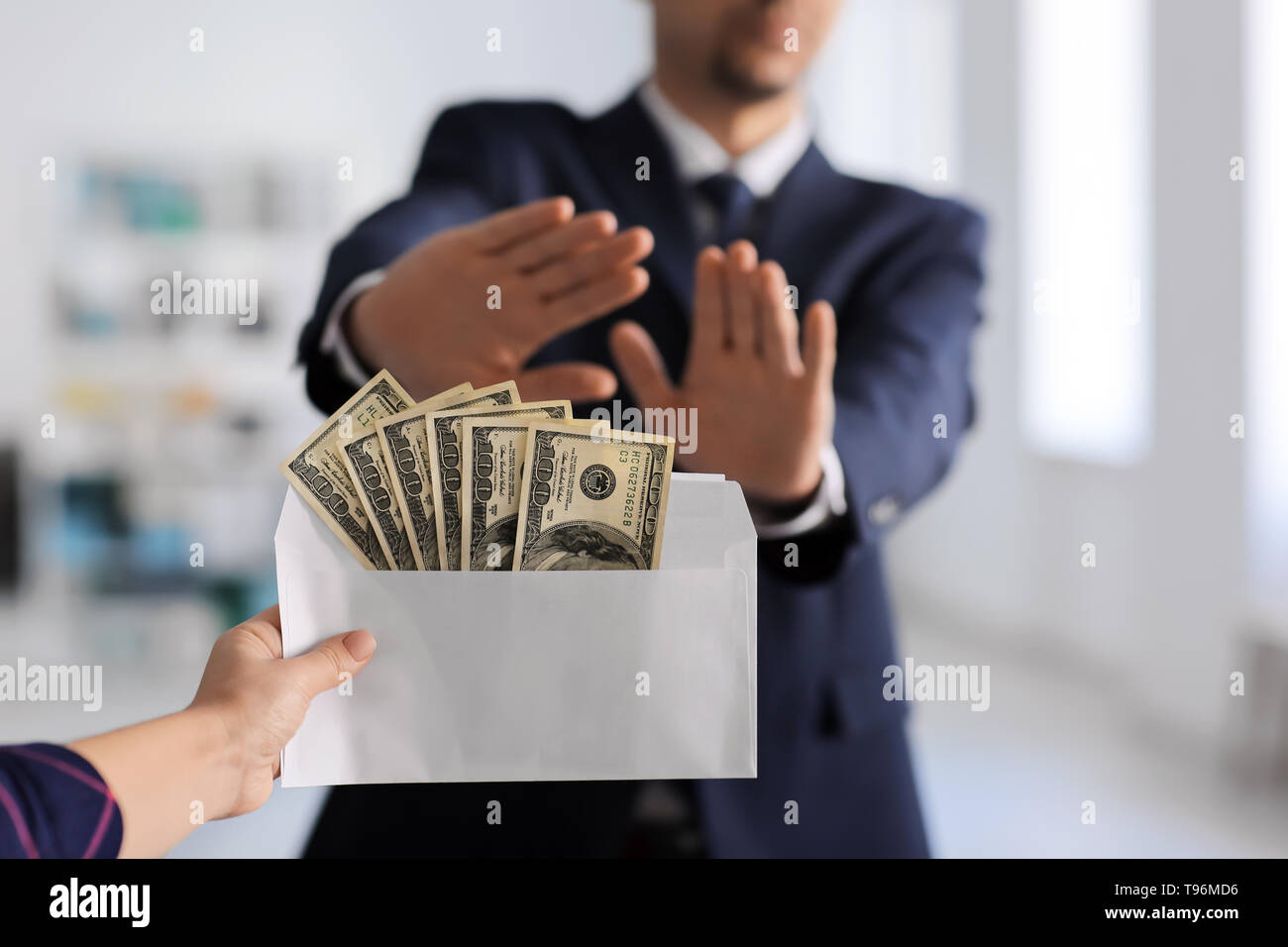 Businessman refusing to take bribe. Corruption concept Stock Photo - Alamy