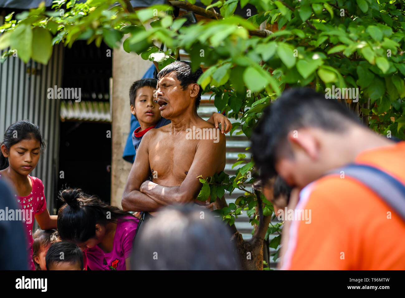 latin family praying in small Guatemalan village Stock Photo - Alamy