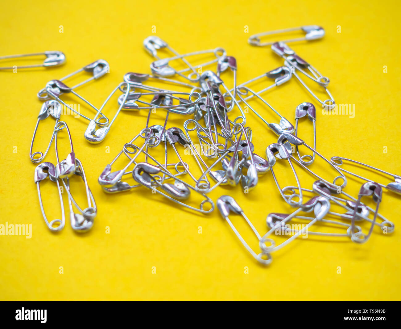 Lots of safety pins. Team concept Stock Photo - Alamy