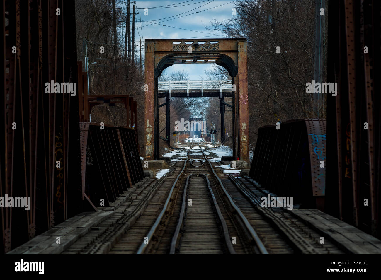 Railway tracks leading to bridge Stock Photo - Alamy