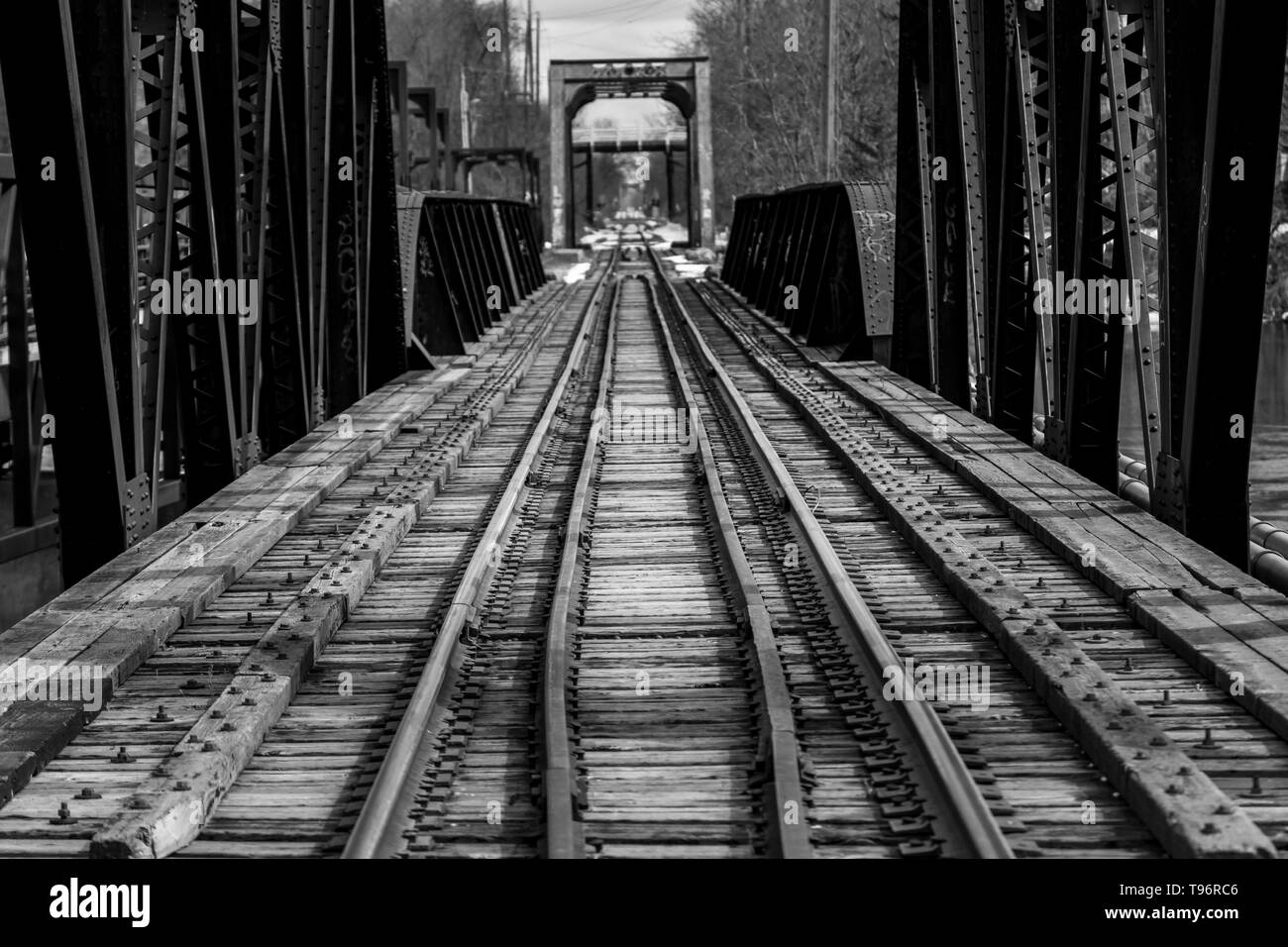 Railway tracks leading to bridge Stock Photo - Alamy