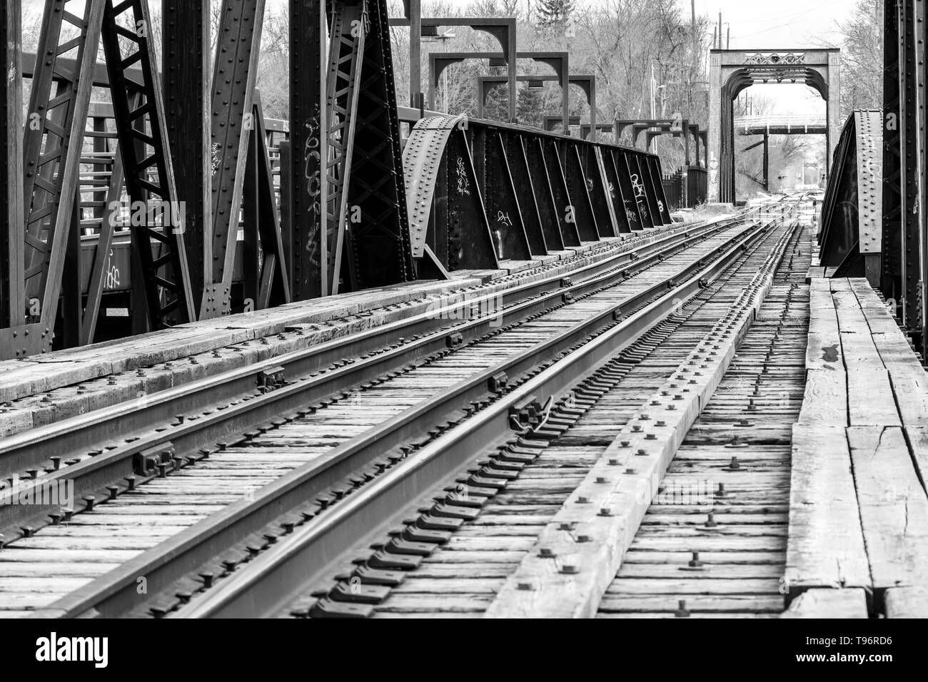 Railway tracks leading to bridge Stock Photo - Alamy