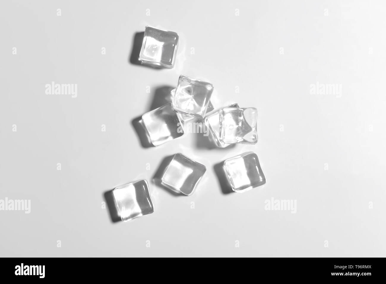 Ice cubes on white background Stock Photo - Alamy