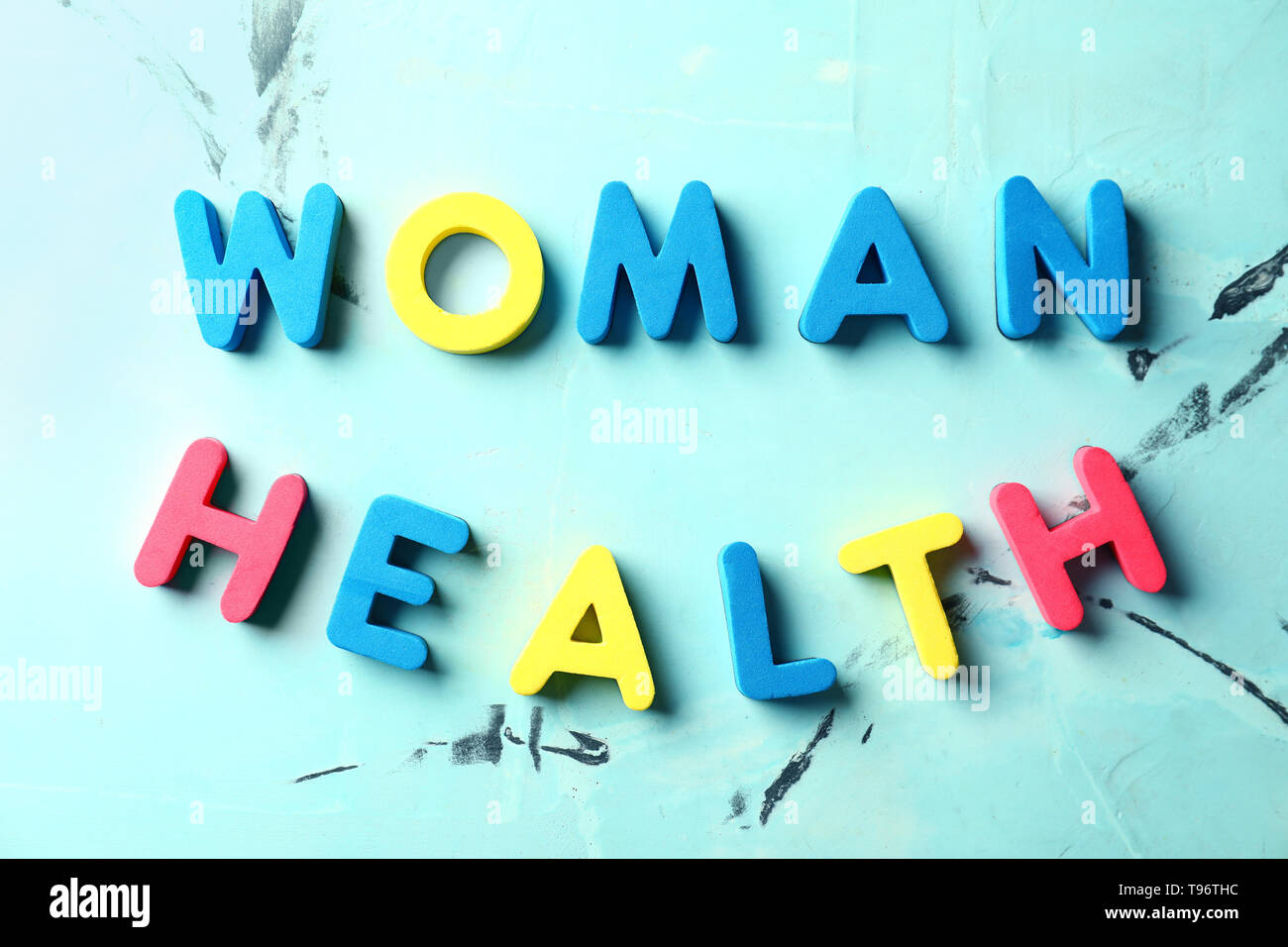 Text WOMAN HEALTH made of color letters on light background Stock Photo ...
