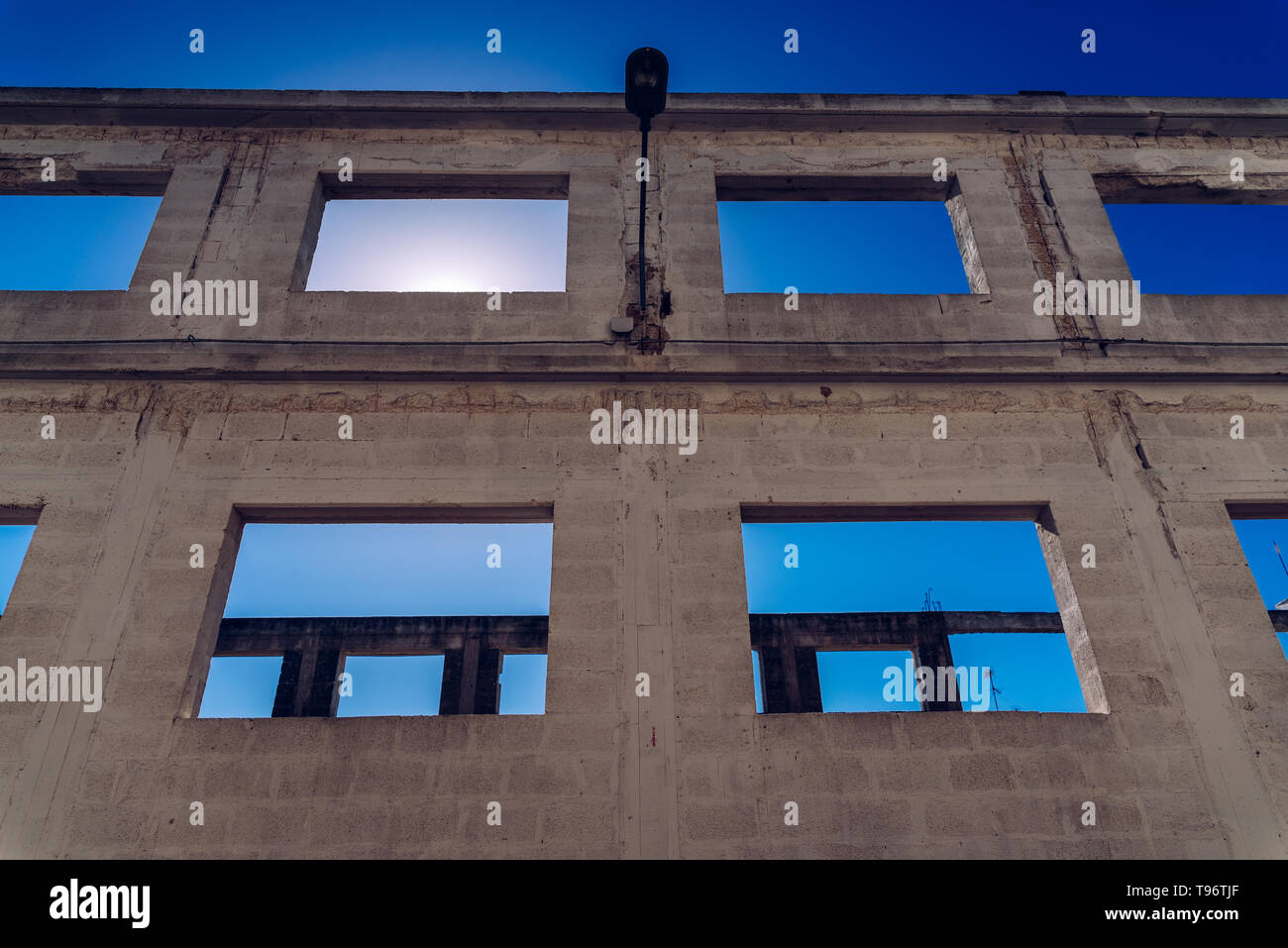 Window of abandoned building without finishing its construction ...