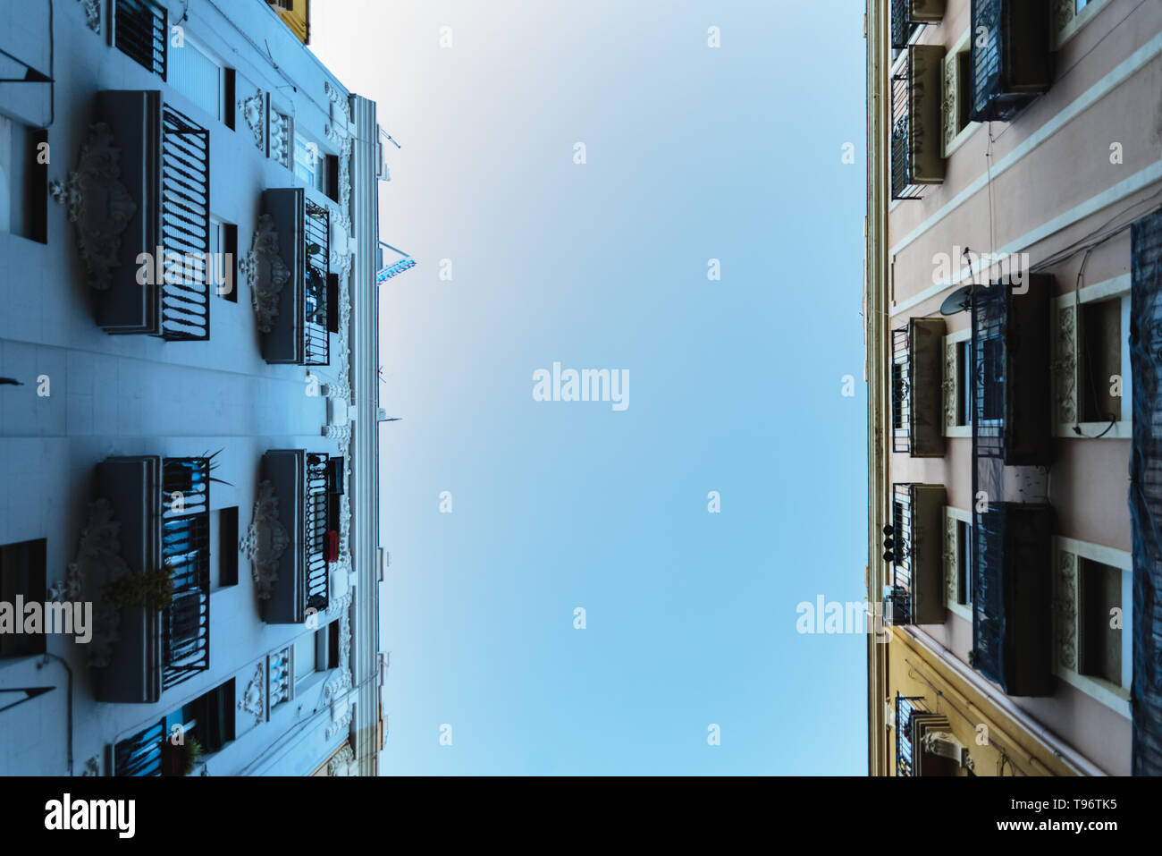 Sky background between two old buildings Stock Photo - Alamy