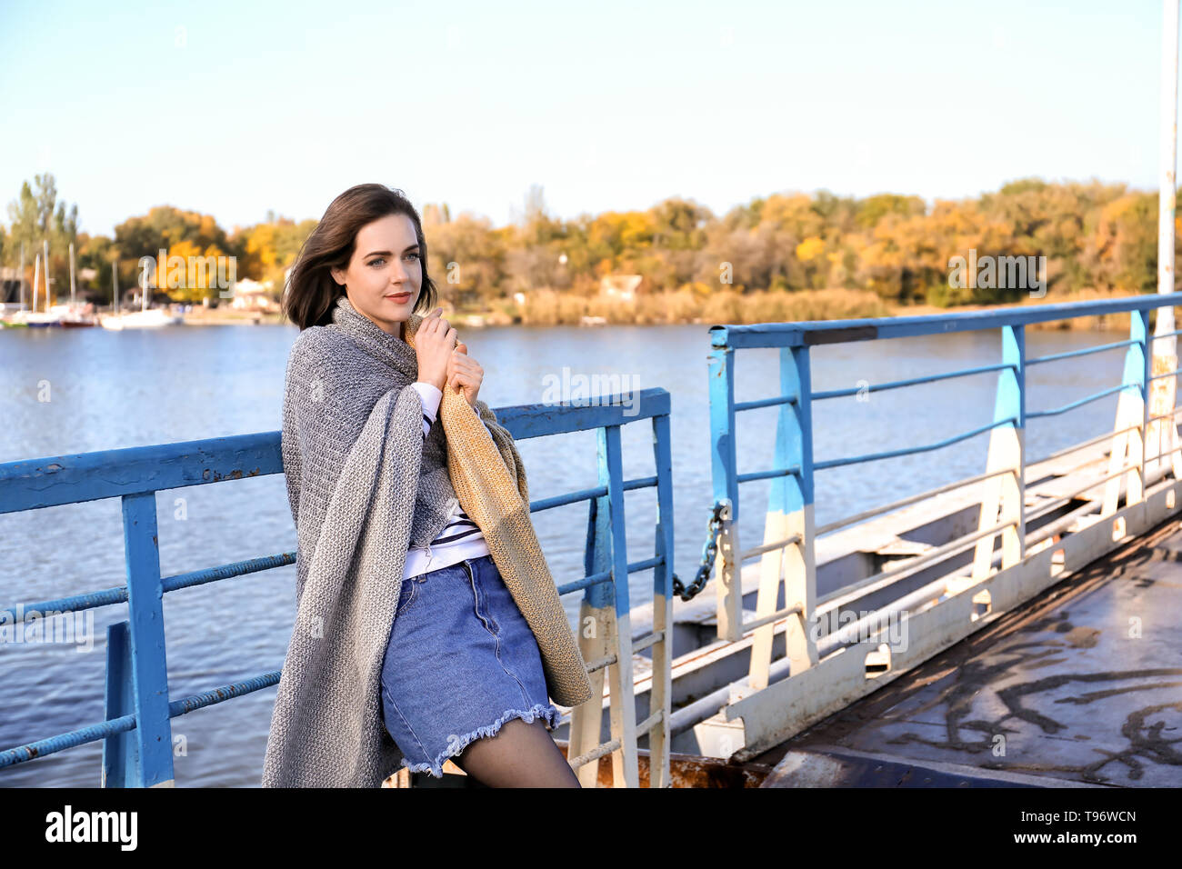 Beautiful young woman on bridge outdoors Stock Photo - Alamy
