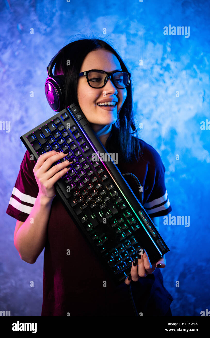 Professional Girl Gamer in MMORPG Strategy Video Game. She's She posing ...