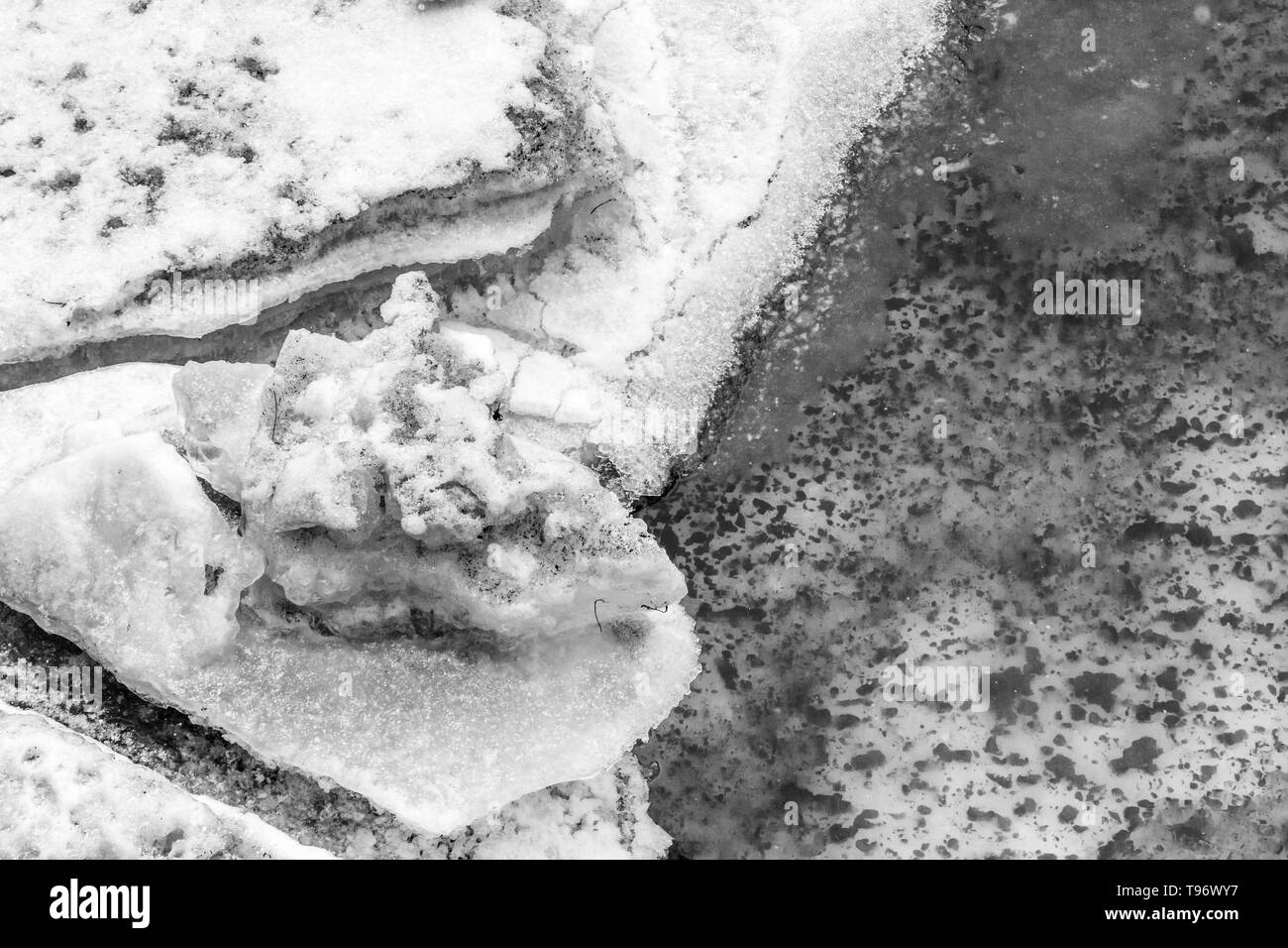 Ice on frozen river Stock Photo - Alamy