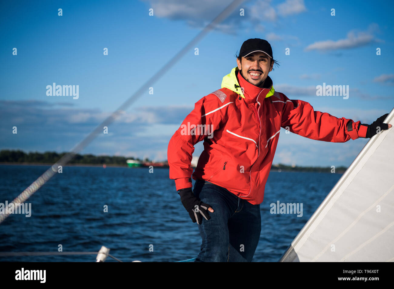 young man working on sailing ship, active lifestyle, summer sport ...