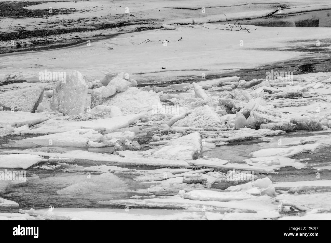 Ice on frozen river Stock Photo - Alamy