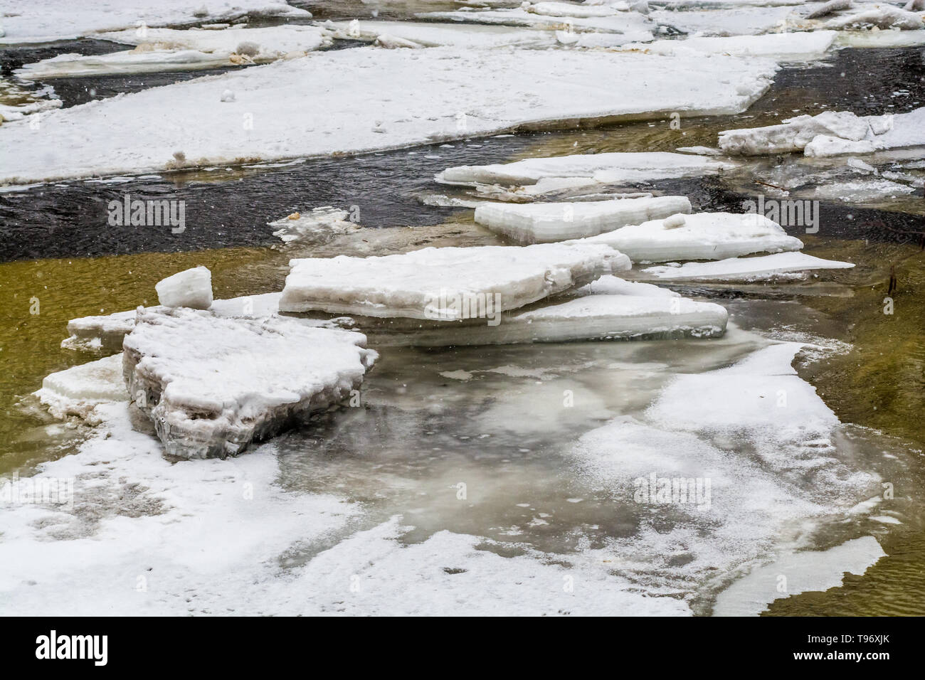 Ice on frozen river Stock Photo - Alamy
