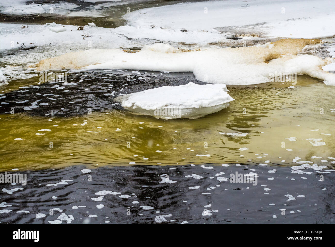 Ice on frozen river Stock Photo - Alamy