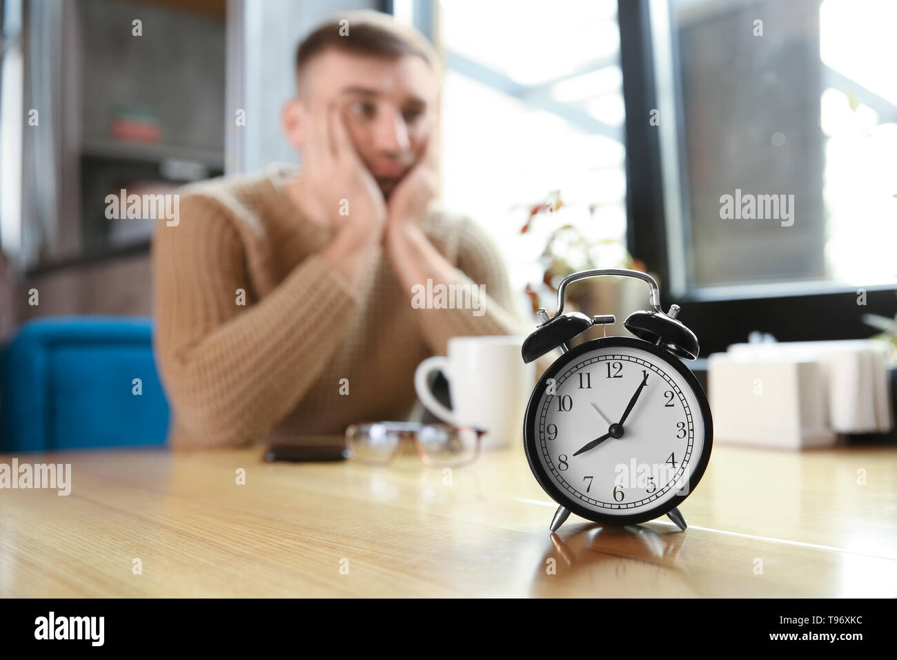 Clock bored man hi-res stock photography and images - Alamy